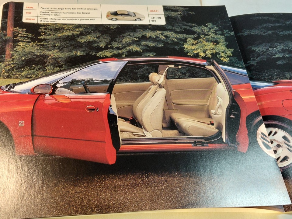1998 Saturn brochure. New. 14 pages w foldout. A Different Kind of ...