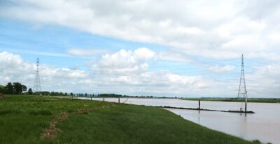Photo 6x4 Electricity and water Ousefleet Tall pylons carrying National ...