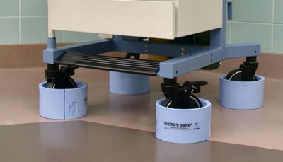 Small CASTrGARD® Caster Wheel Guard, For up to 5" Casters Light Blue 4 ...