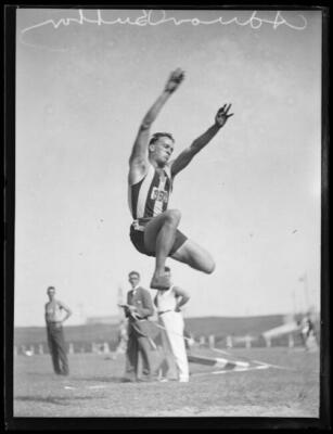 Athlete Adrian Button landing from a long jump, NSW, 13 March 1934 Old ...