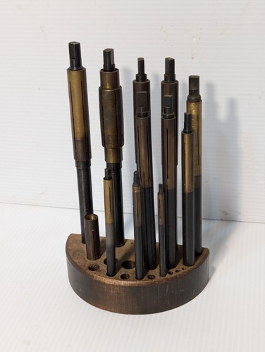 Incomplete set of 11 barrel laps, blind hole lap reamers w/wood holder ...