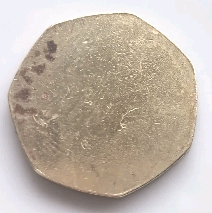 UNIDENTIFIED 7 SIDED BLANK PLANCHET COIN, SLIGHTLY LARGER & THICKER ...