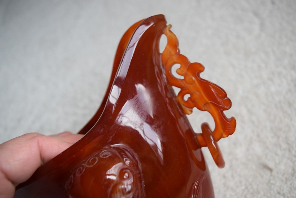 A Chinese red agate well carved dragon, elephant and fu dog large cup 7 ...
