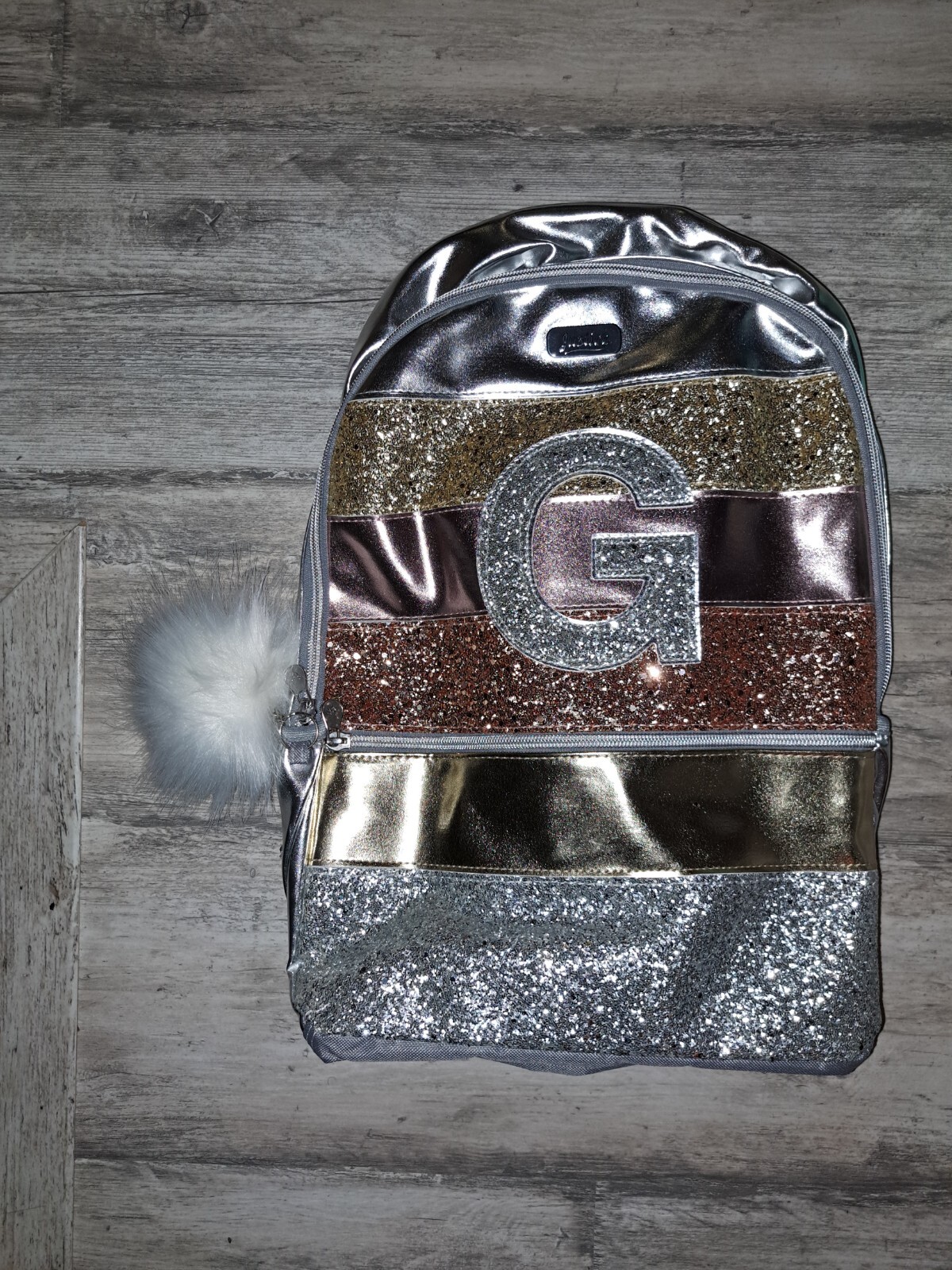 Glittery justice backpack with letter G | eBay