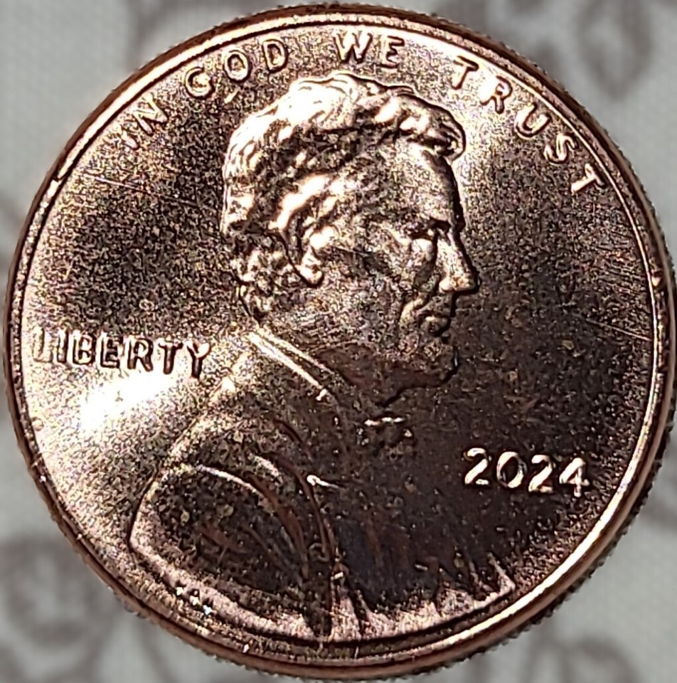 2024 penny spike through back to front of face, faint spike R, fresh ...