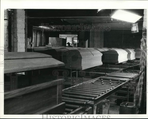 Press Photo Caskets waiting to be stained at Marsellus Casket Company ...