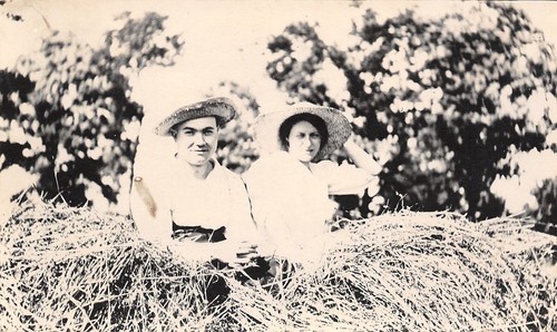 Real Photo Postcard~Couple in Hay Mound~Straw Hats~c1910 RPPC | eBay