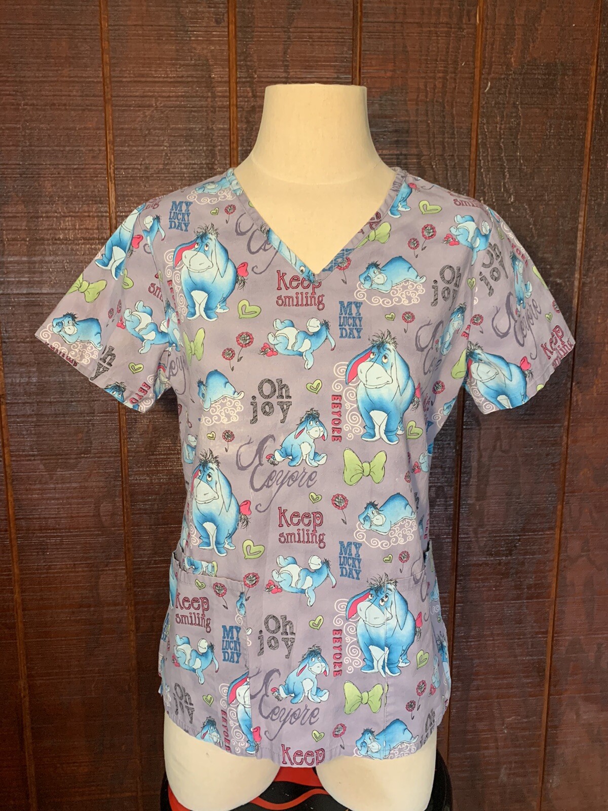 Womens The Wonderful World Of Disney Eeyore Scrub Top… - Gem
