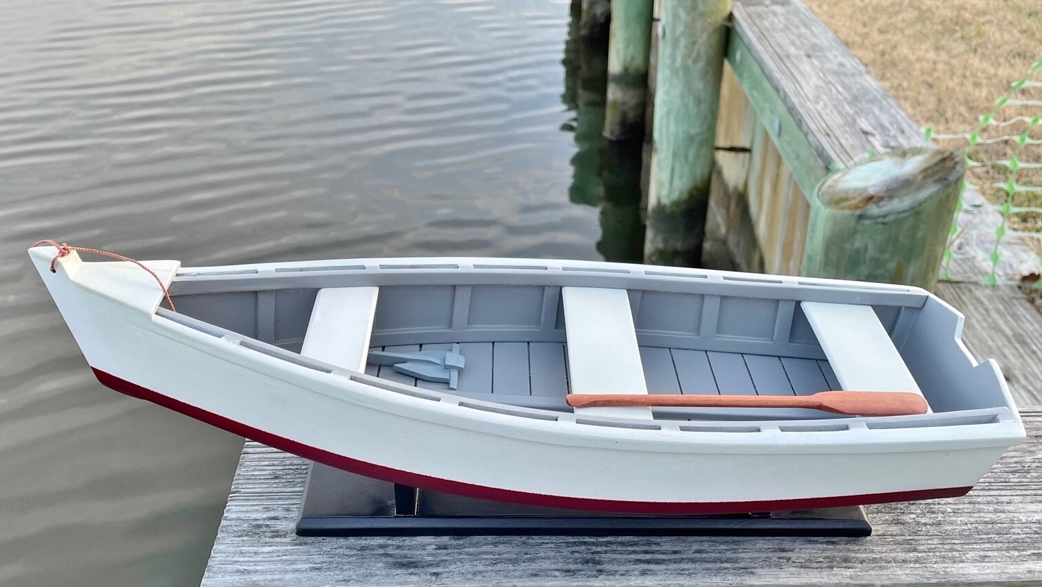 WOODEN SKIFF MODEL, 17.50 INCHES LONG, WITH ANCHOR, PADDLE AND DISPLAY ...