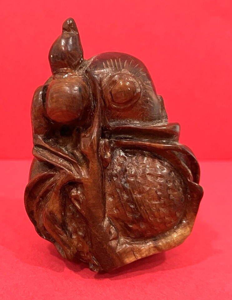 Wood carved MAN w/ TURTLE SHELL STOMACH holding CHICKEN 2" x 1.5" x 1. ...