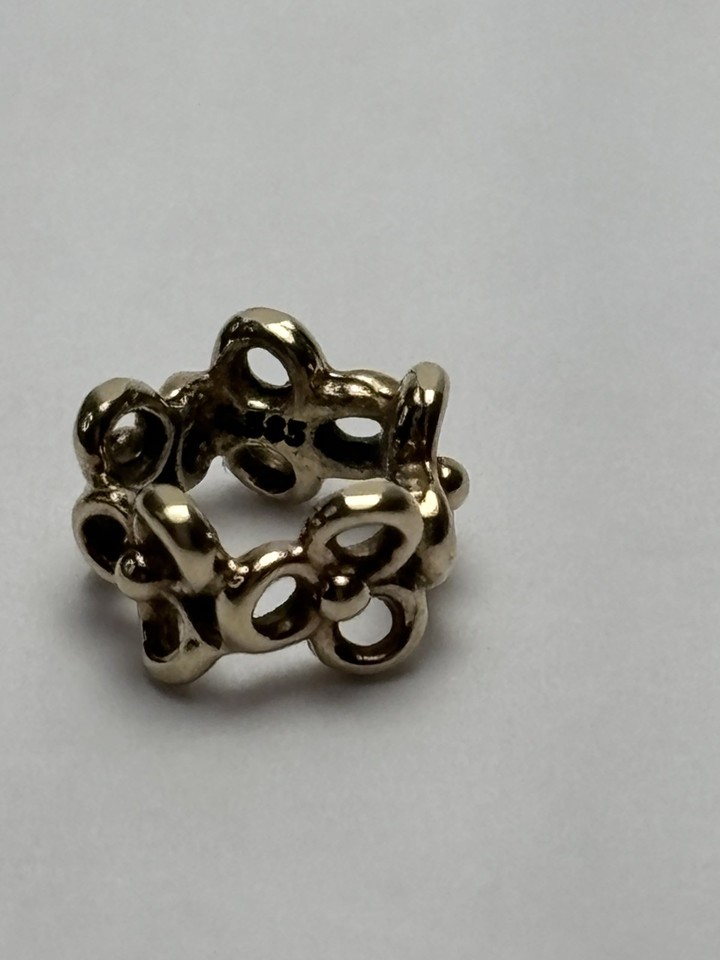 Pandora 14k yellow gold Trinity flower spacer charm with the item ...