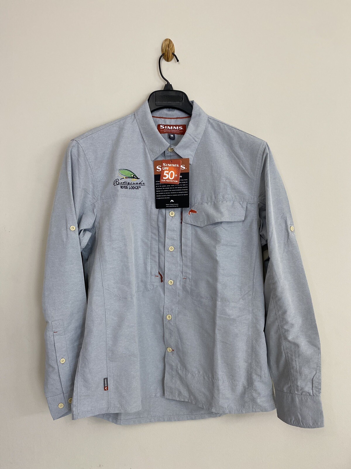 Simms light blue vented fishing shirt W zip pockets. River Lodge Logo ...