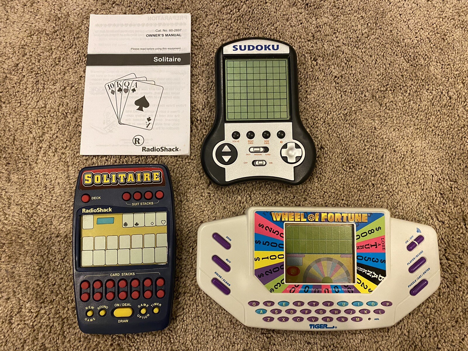 Vintage handheld electronic games set - Solitaire, Sudoku, and Wheel Of ...
