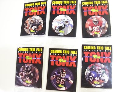 FOOTBALL POGS BY CLASSIC TONX d. SANDERS, AIKMAN, L. TAYLOR, RICE ETC ...