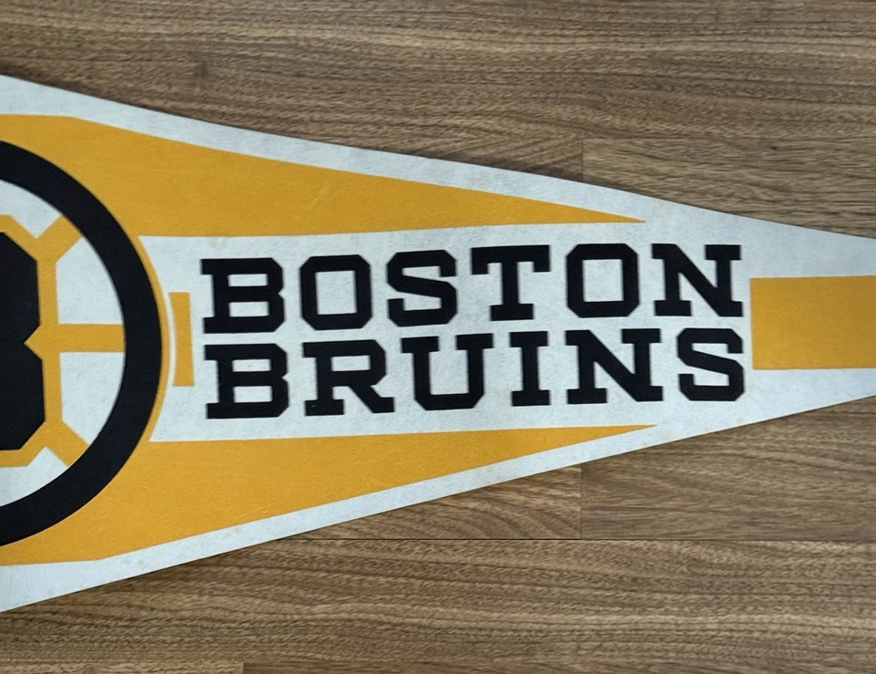 vintage Boston Bruins felt pennant featuring the iconic Spoked-B logo ...