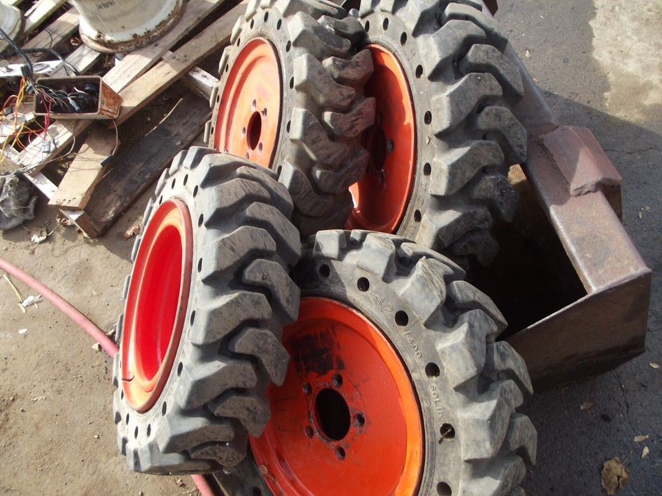 5.70-12 solid tires and rims (4) bobcat 371 310 440b rounder L600 skid ...