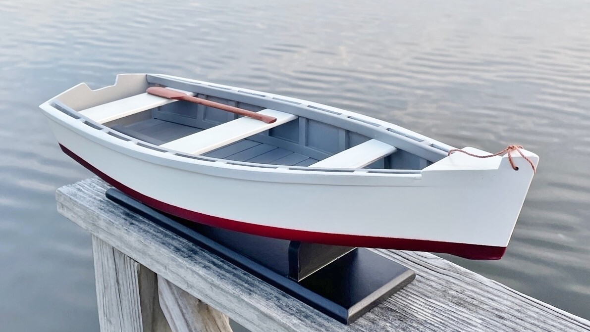 WOODEN SKIFF MODEL, 17.50 INCHES LONG, WITH ANCHOR, PADDLE AND DISPLAY ...