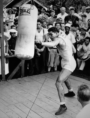 Joe Louis boxing punching bag at public training Pompton Lakes Ne- 1937 ...