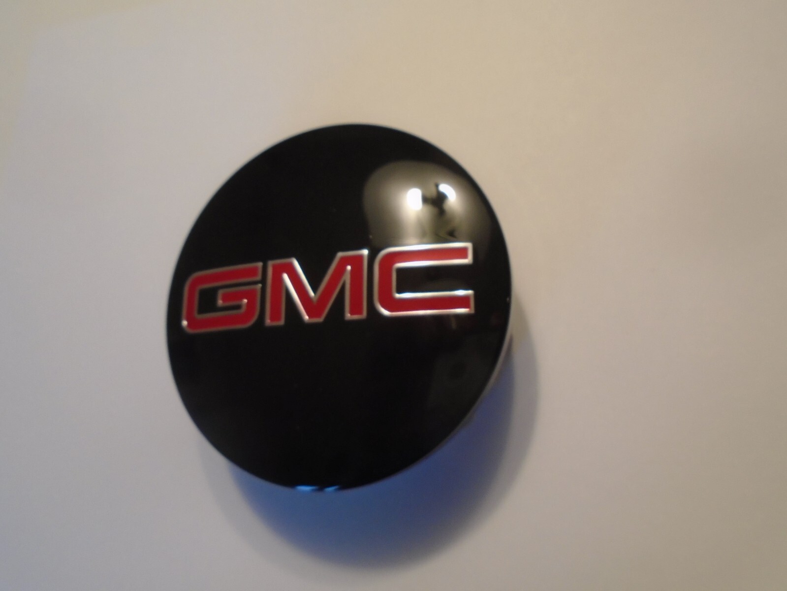 GMC CENTER CAP NEW 22837060 gm PA66 PPL black red letters plastic | eBay