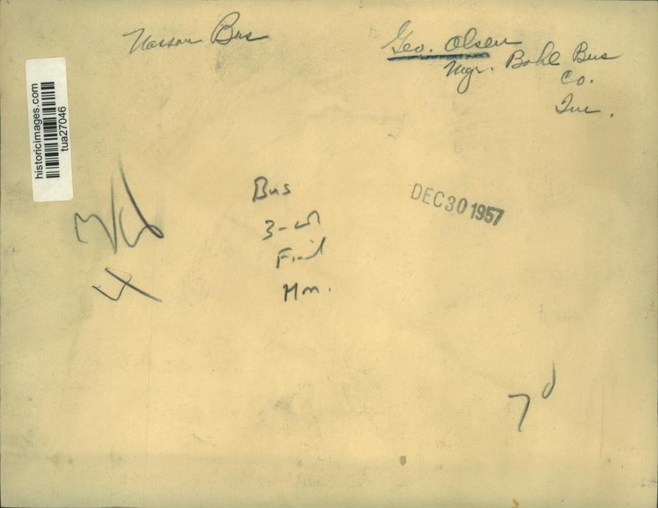 1957 Press Photo George Olsen, Manager of Bohl Bus Company, stands on ...