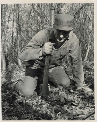 1968 Press Photo Man digs instant foxhole with Astrolite explosives ...