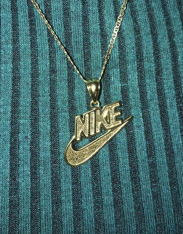 Gold Nike Swoosh Logo