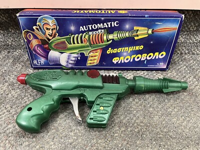 * VINTAGE ALFA AUTOMATIC GREEN FRICTION BASED SPACE GUN #50 GREECE *ST ...