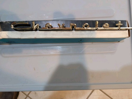 B73 NOS 1957 57 Chevy Belair V8 Chevrolet Script Emblem Gold 3733212 GM ...