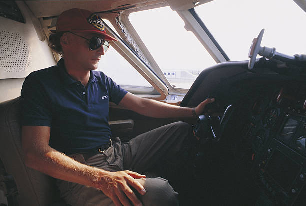 Austrian car racing driver Niki Lauda sitting in cockpit an ai- 1980 ...