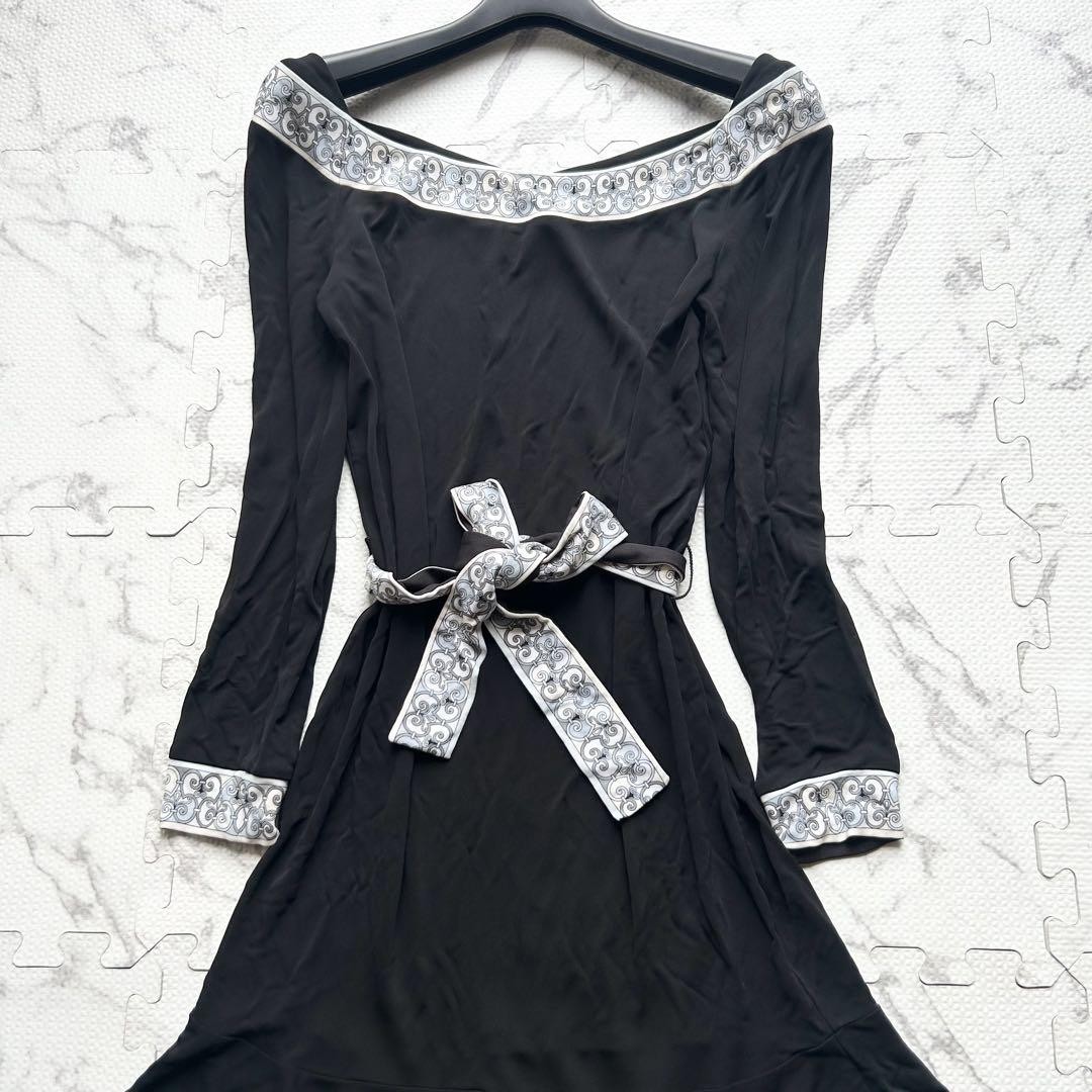 Emilio Pucci knee-length dress, Pucci pattern, peplum, black ribbon ...