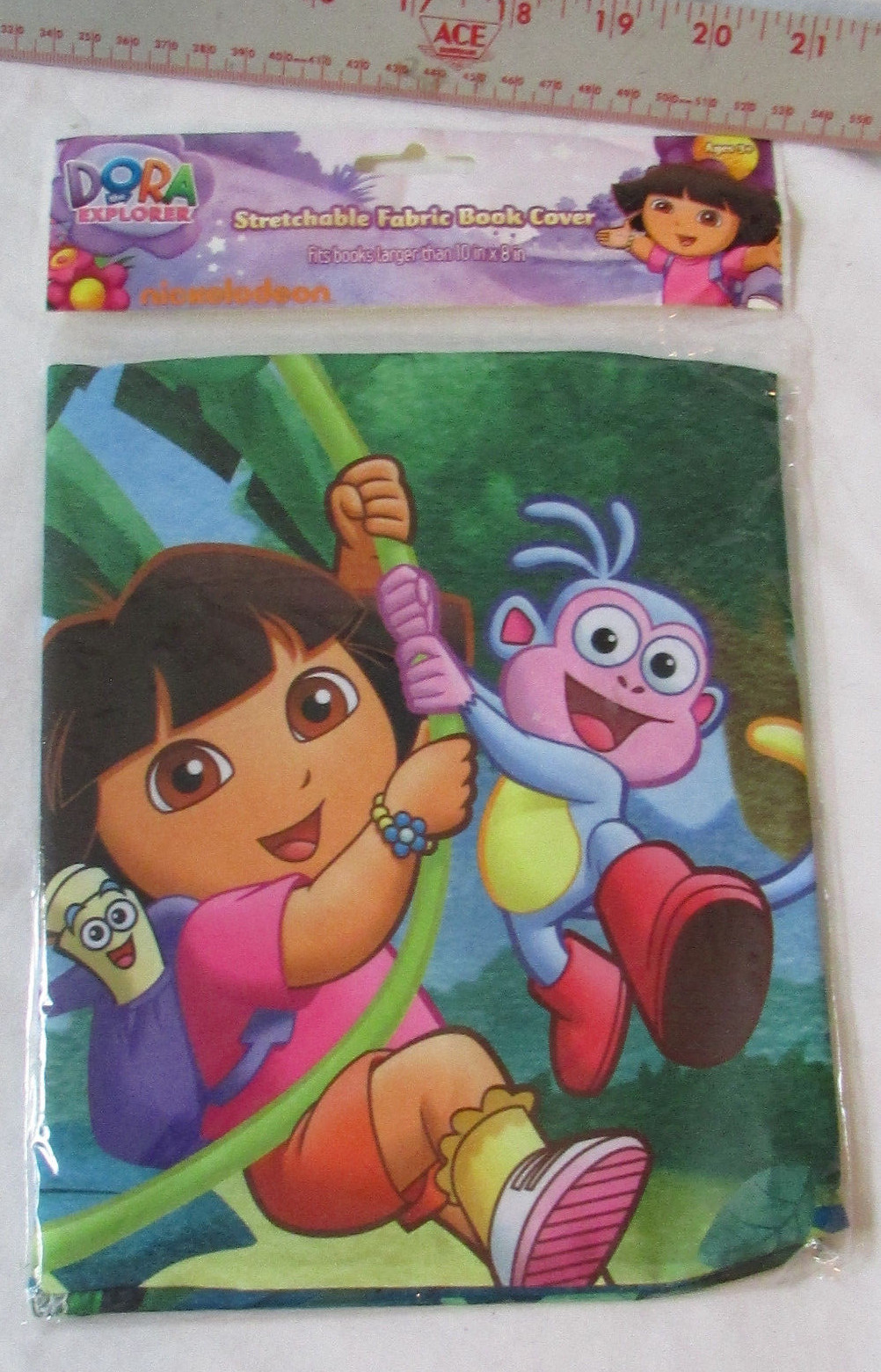 DORA THE EXPLORER Book Cover 2010 NOS Stretchable Fabric Sealed Pkg ...