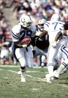 Eric Dickerson Indianapolis Colts carries the ball in a late Football ...