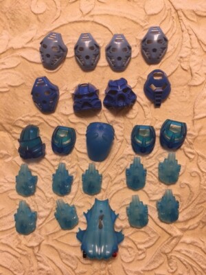 Lego Bionicle parts - masks, some translucent blue with special pieces ...