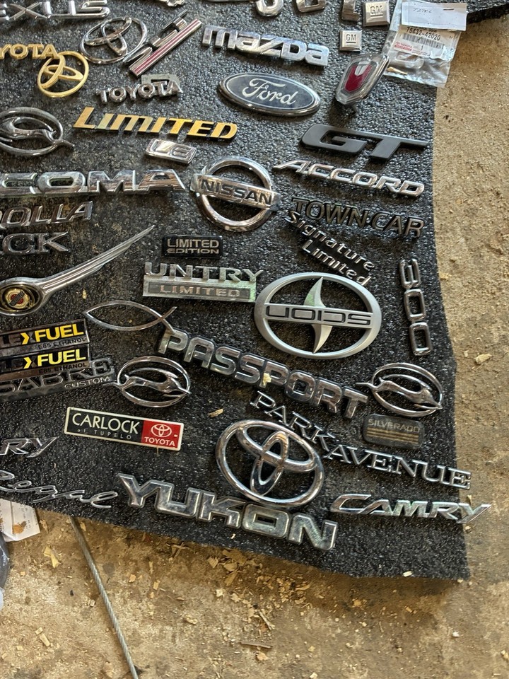 EMBLEMS BADGES LETTERS ASSORTMENT OF OEM EMBLEMS LOT Dodge Ford Toyota ...