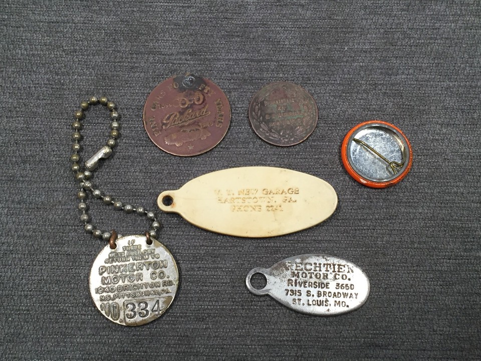 Lot of vintage dealer tags tokens Chevrolet Ford Pontiac Packard TROG ...