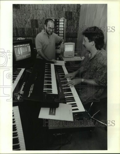 1991 Press Photo Composer Paul English works with partner Brian Green ...