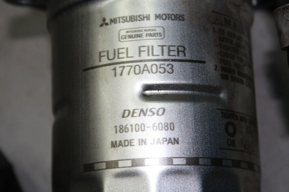 Fuel filter housing 1770A053 Denso 186100-6080 Mitsubishi L200 KB4T Bj ...