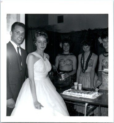 1950s Prom Couple with Women Hula Outfits Serving Punch and Cake ...