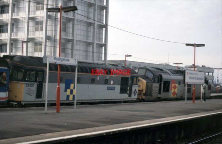 PHOTO (2) CLASS 37 37009 + 33050 PASSES BASINGSTOKE 19 JAN 1992 ON DC ...