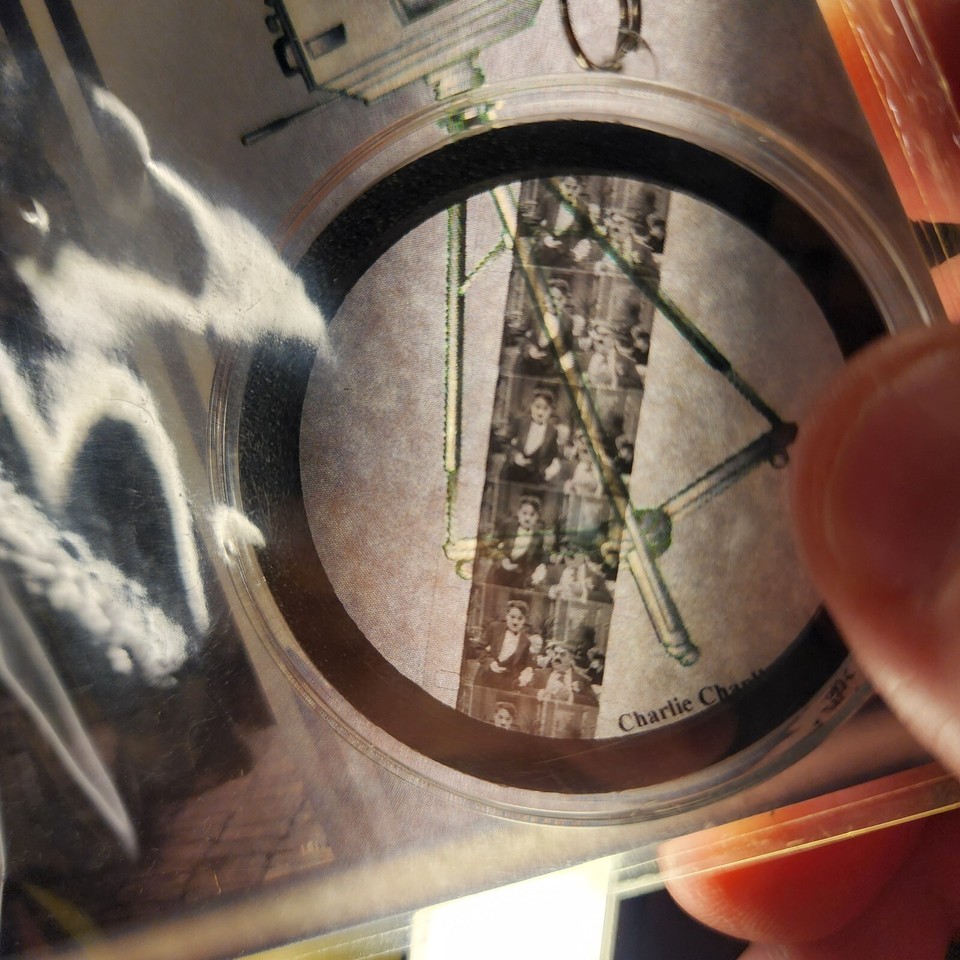 charlie chaplin vintage film cells. strip inside round case, photo ...