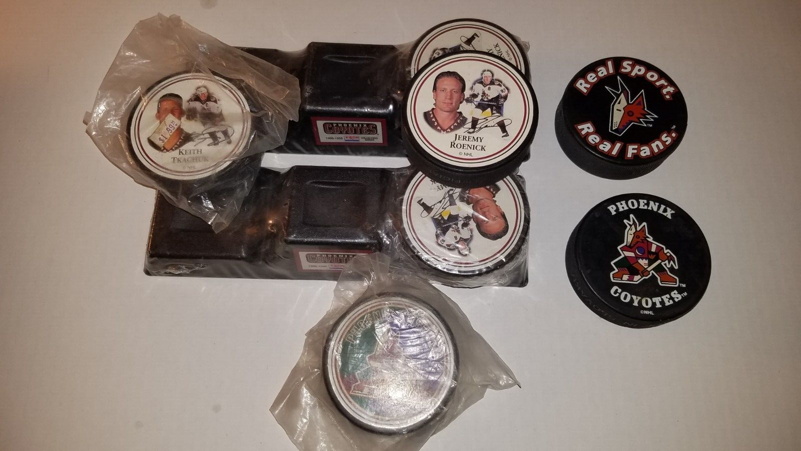 Phoenix Coyotes hockey puck assortement lot! 7 Coyotes pucks 1 Oilers ...