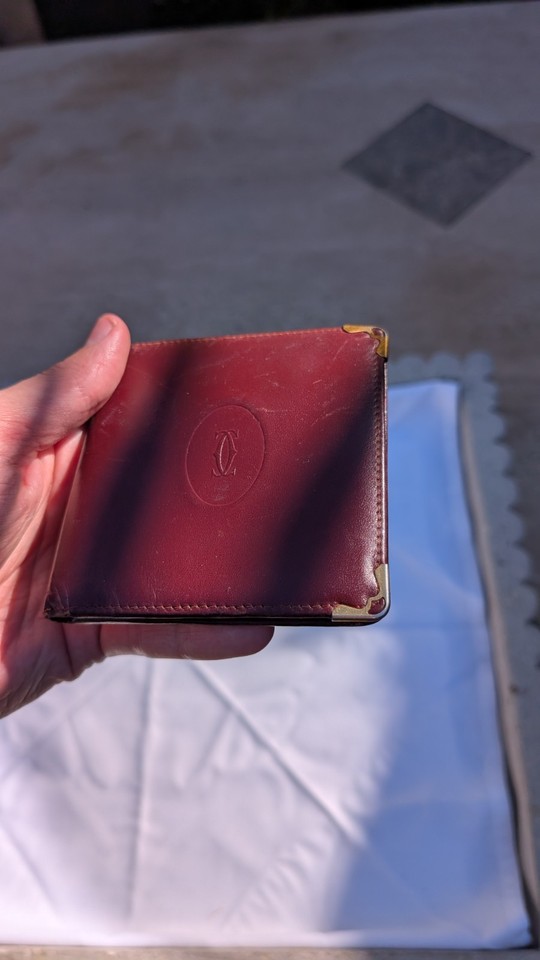 Burgundy leather Cartier Mast Collection 2-fold wallet with embossed ...