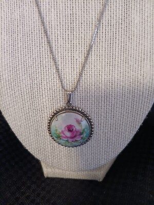 Vintage Round Floral Themed Pendant encased in antique silver tone ...