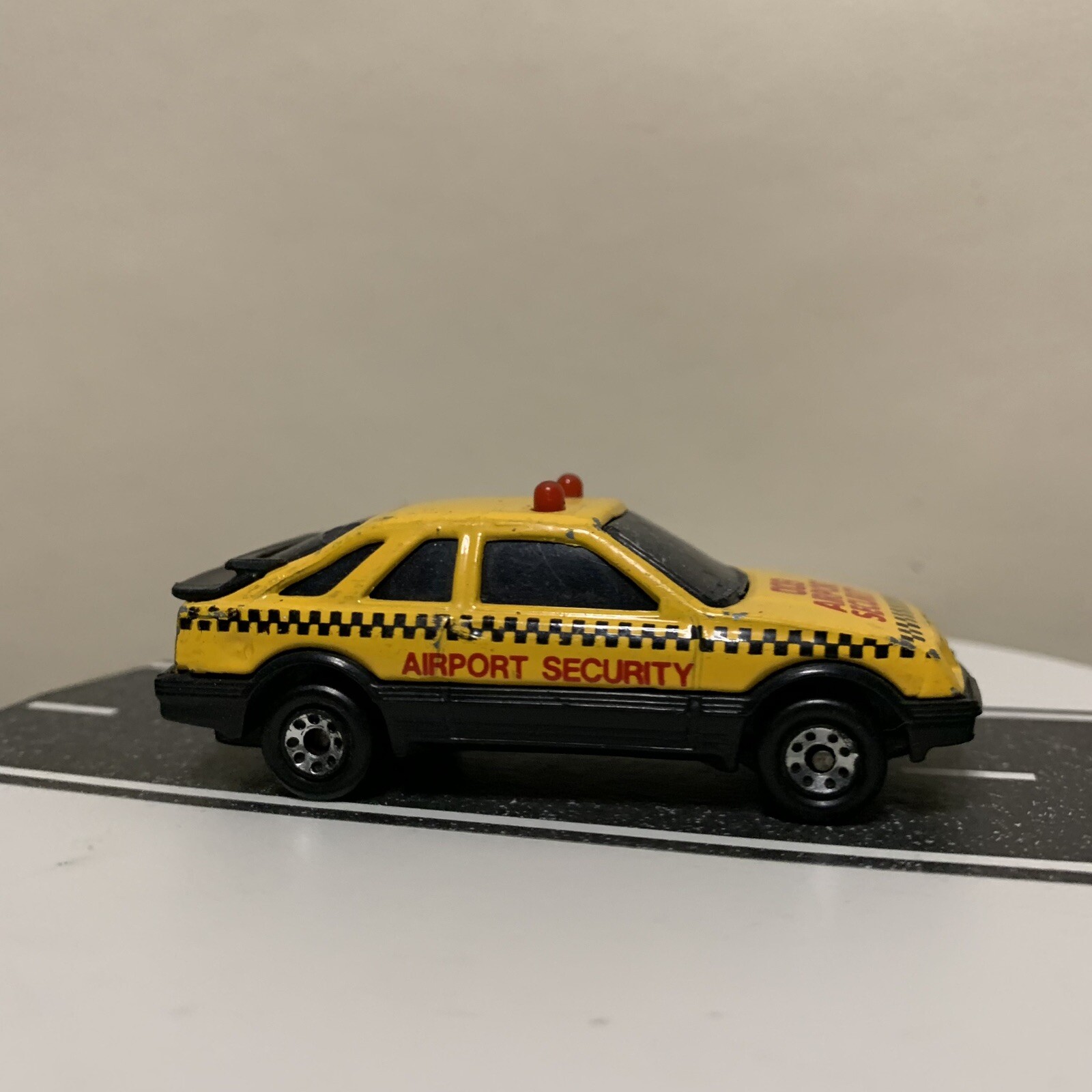 Matchbox Ford Sierra XR4i 1:58 Airport Security Car Yellow/Black/Red As ...