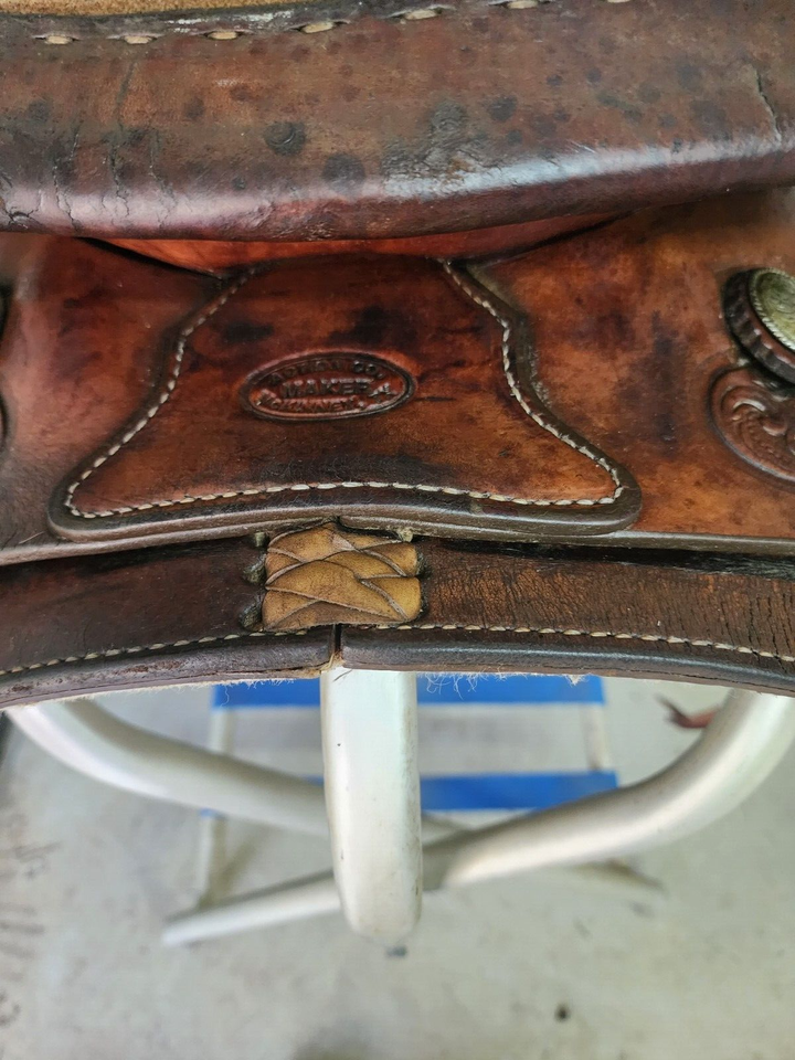 A good Used Older 15" Brown Color Action Co. Roping Saddle with some ...