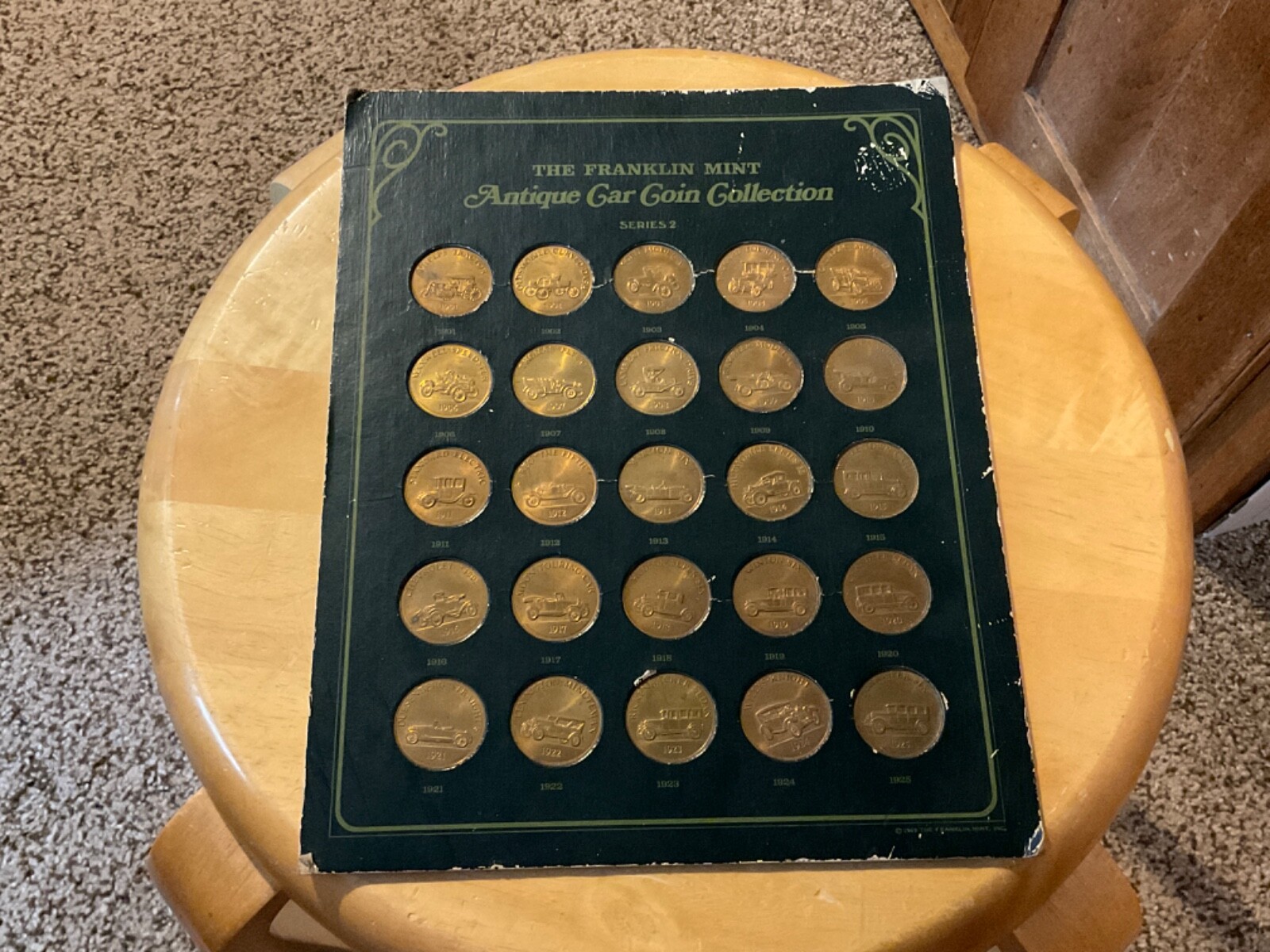 The Franklin Mint Antique Car Coin Collection Series #2. Board shows ...