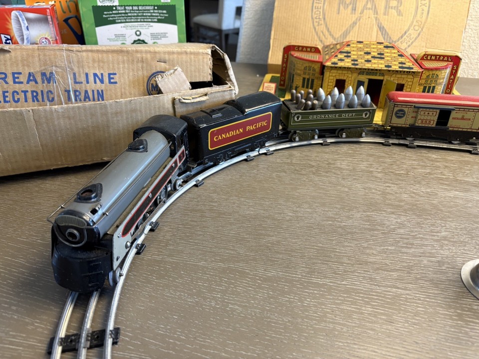 vintage marx electric train set dated 1939. Several train cars and ...