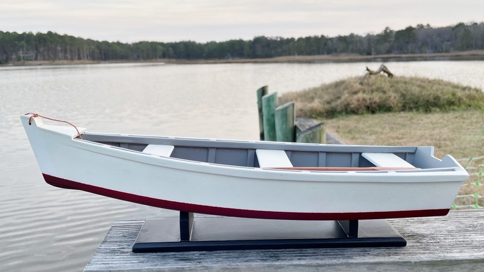 WOODEN SKIFF MODEL, 17.50 INCHES LONG, WITH ANCHOR, PADDLE AND DISPLAY ...