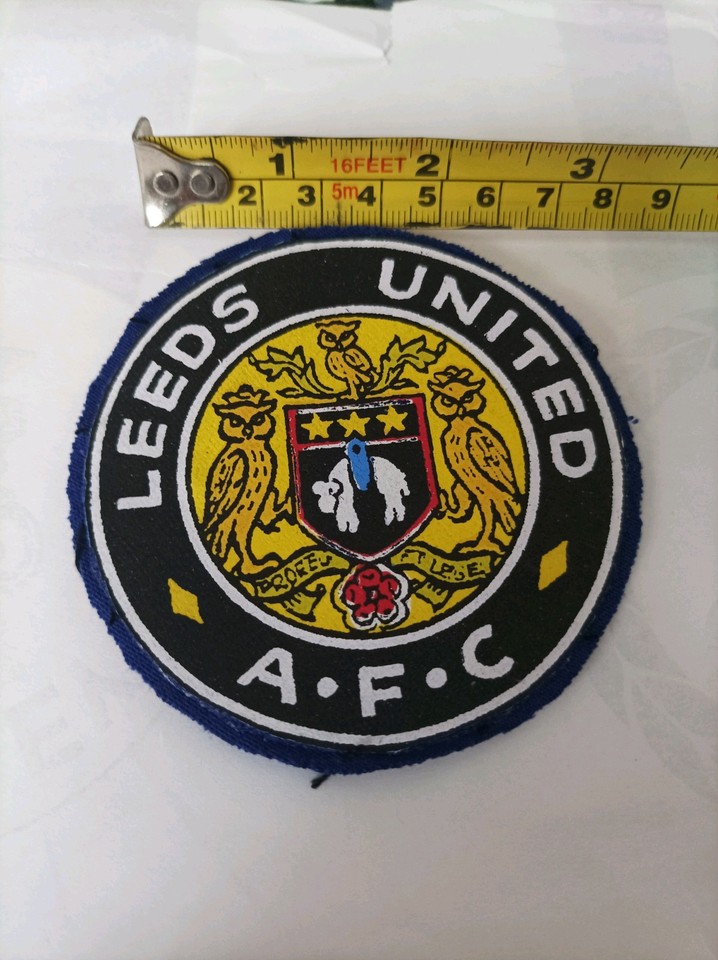 Set Of Leeds United Items, Rosette, Pennant, And a Sew On Patch/Badge ...