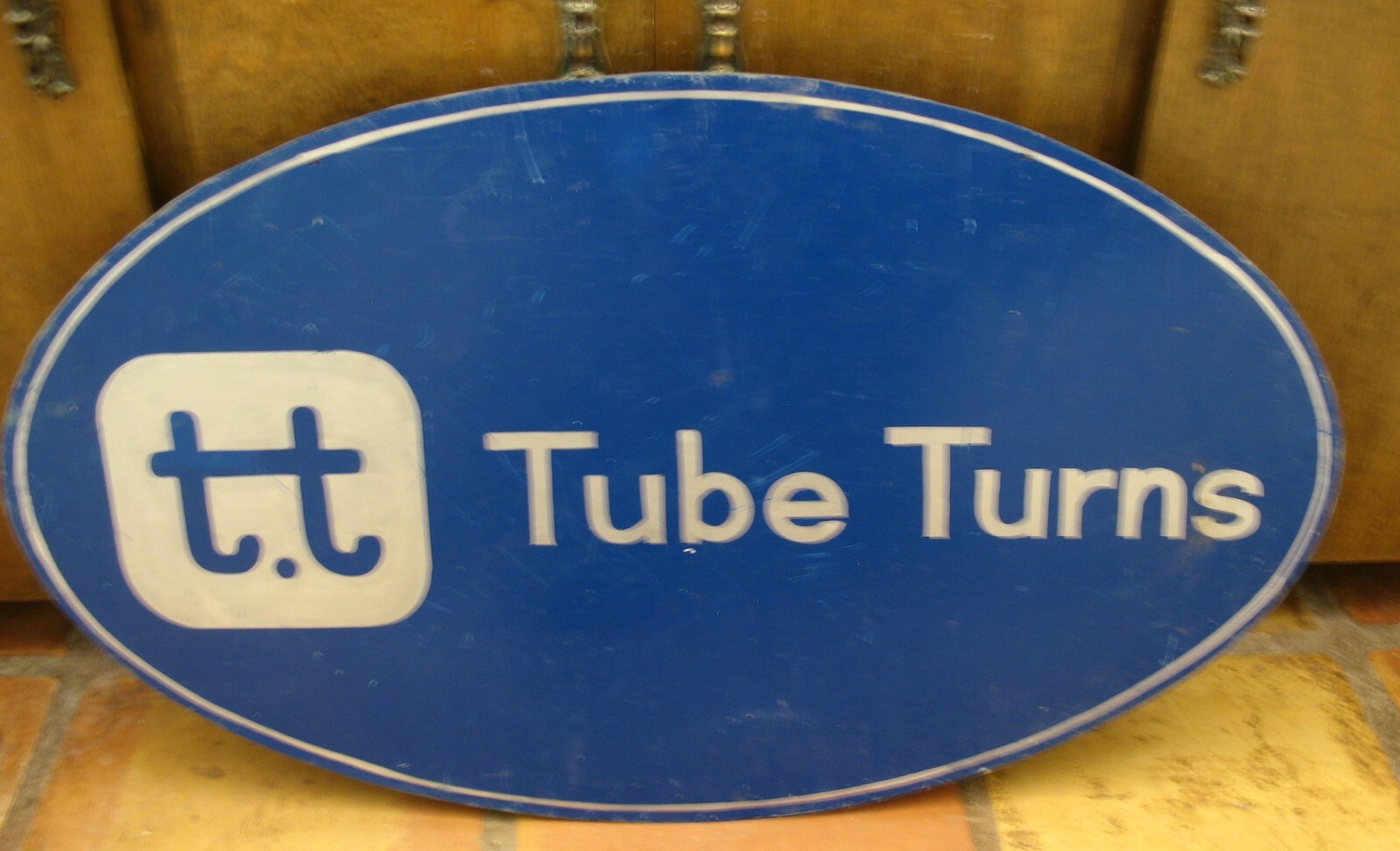 E8 - VINTAGE TUBE TURNS OVAL METAL ADVERTISING SIGN, Measures 30.5" x ...